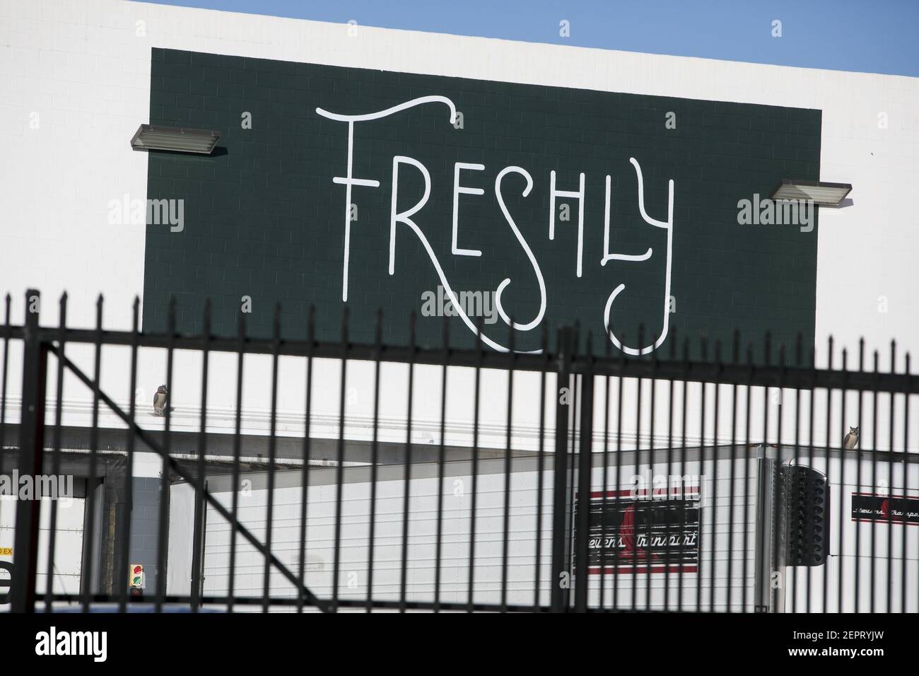 A logo sign outside of a facility occupied by Freshly in Phoenix ...