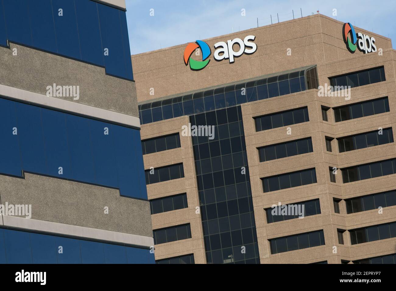A logo sign outside of the headquarters of Arizona Public Service (APS ...