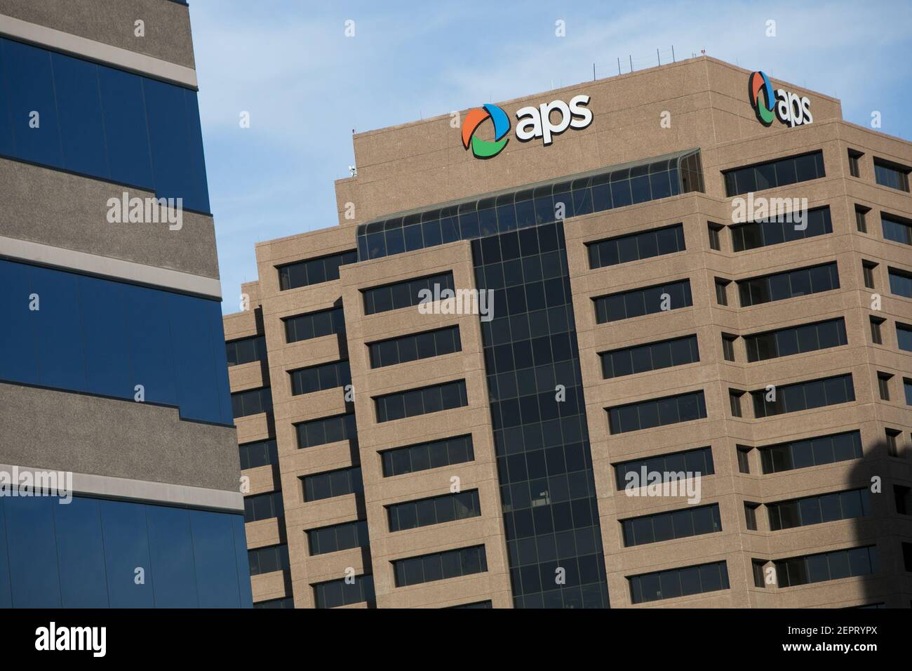 A logo sign outside of the headquarters of Arizona Public Service (APS ...