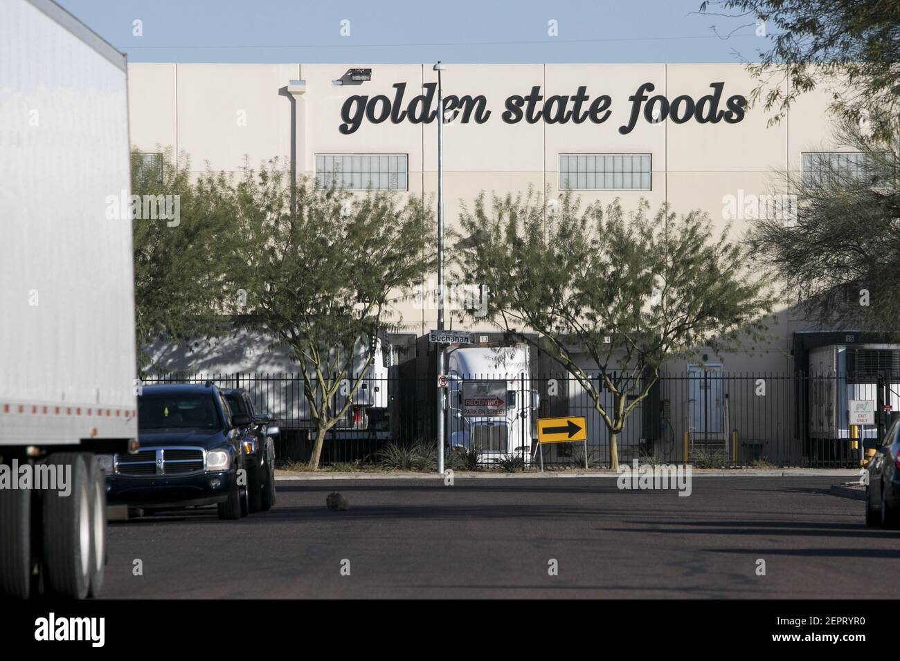 A logo sign outside of a facility occupied by Golden State Foods in ...
