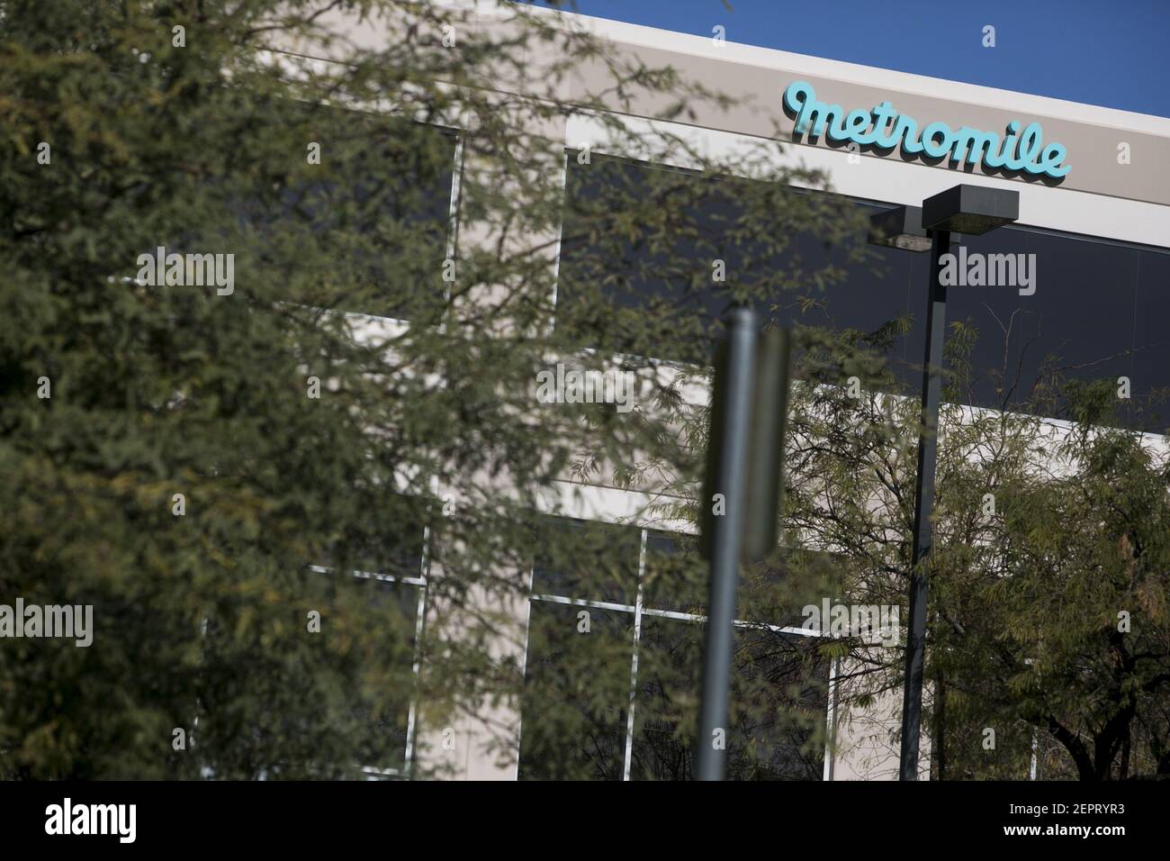 A logo sign outside of a facility occupied by Metromile in Tempe ...