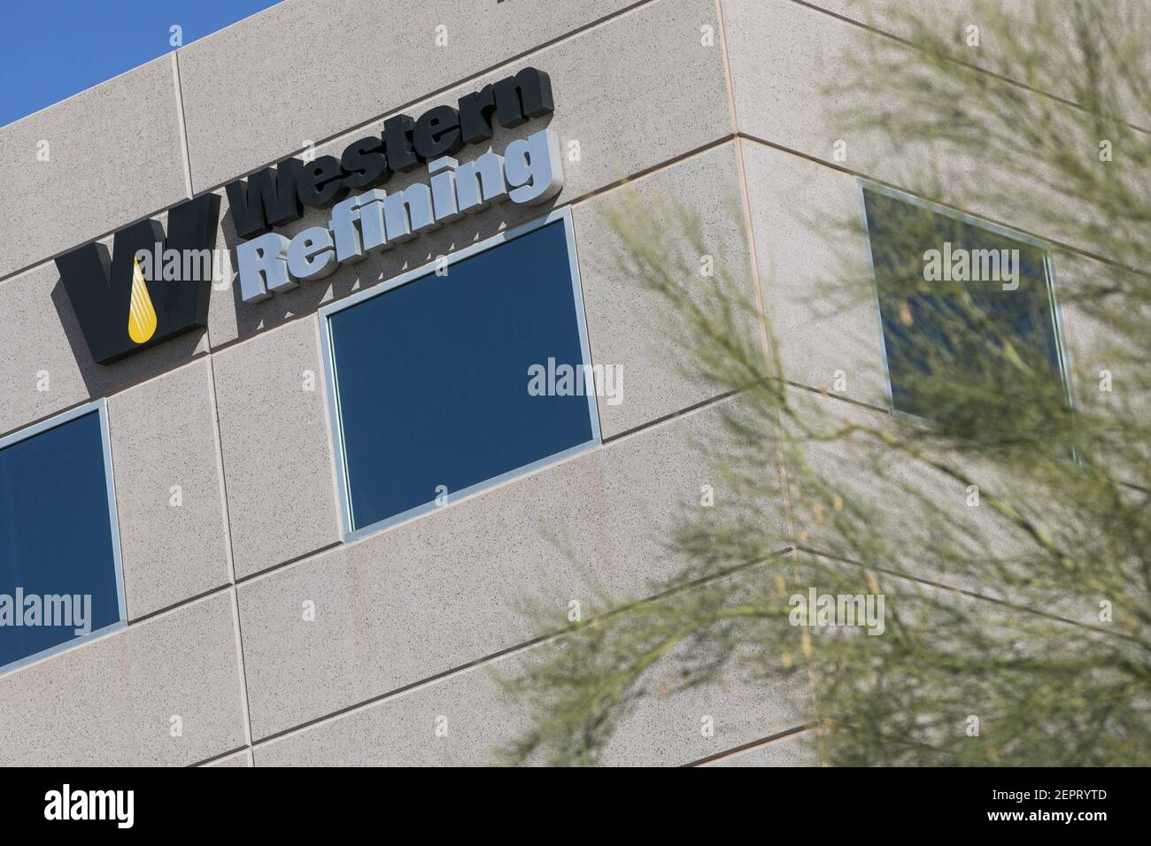 A logo sign outside of a facility occupied by Western Refining, Inc ...