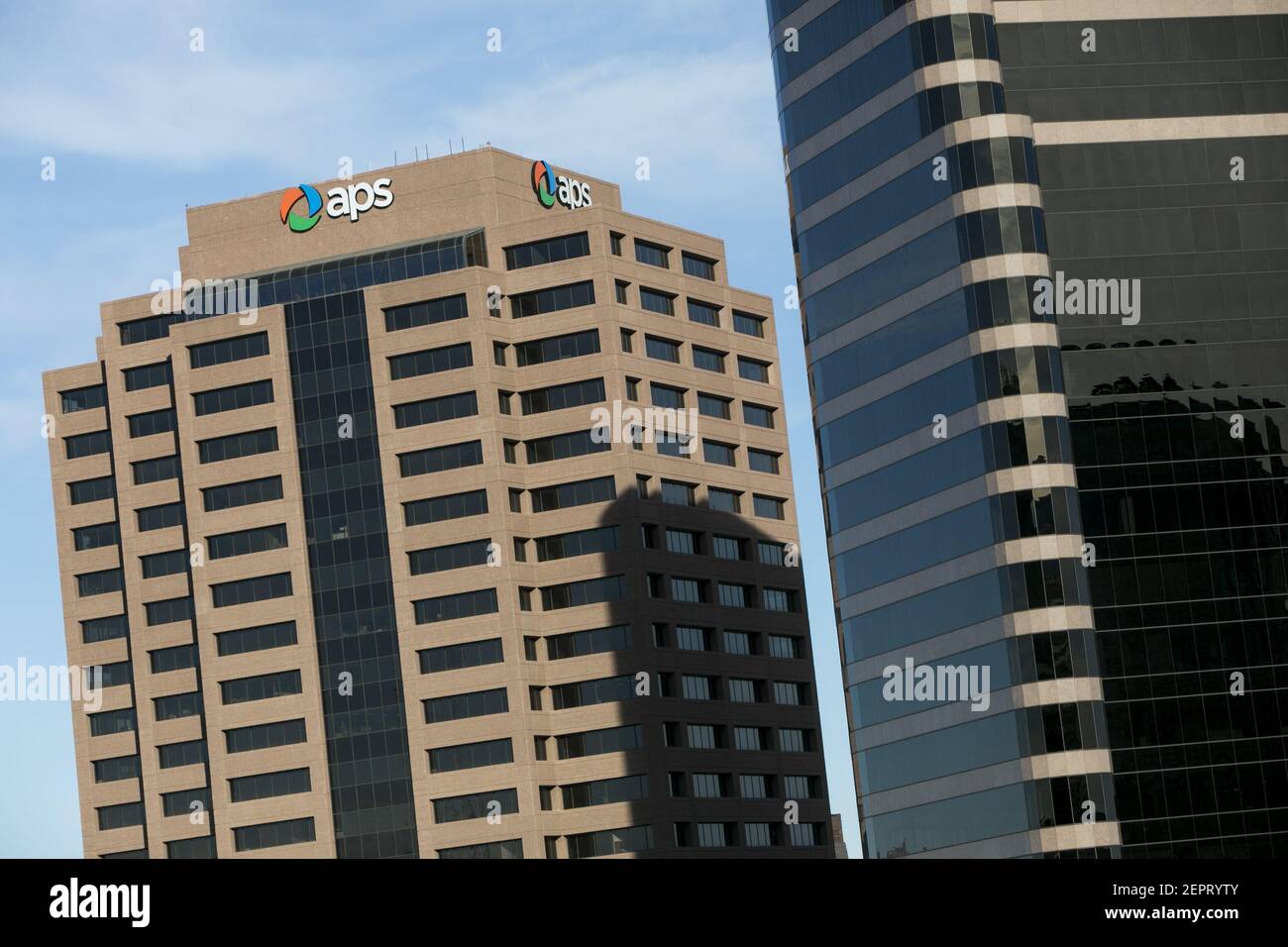 A logo sign outside of the headquarters of Arizona Public Service (APS ...