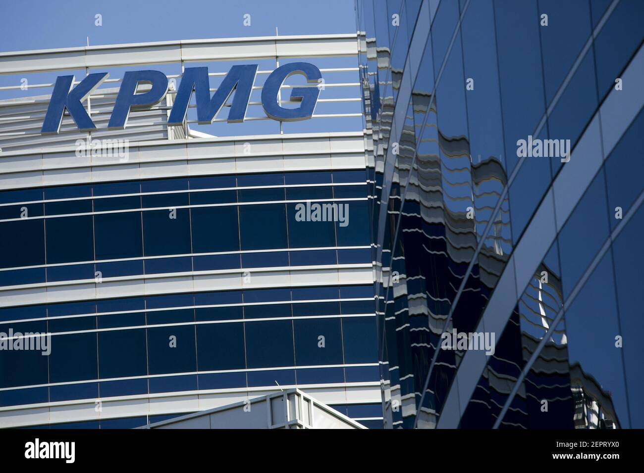 A logo sign outside of a facility occupied by KPMG in Tempe, Arizona ...