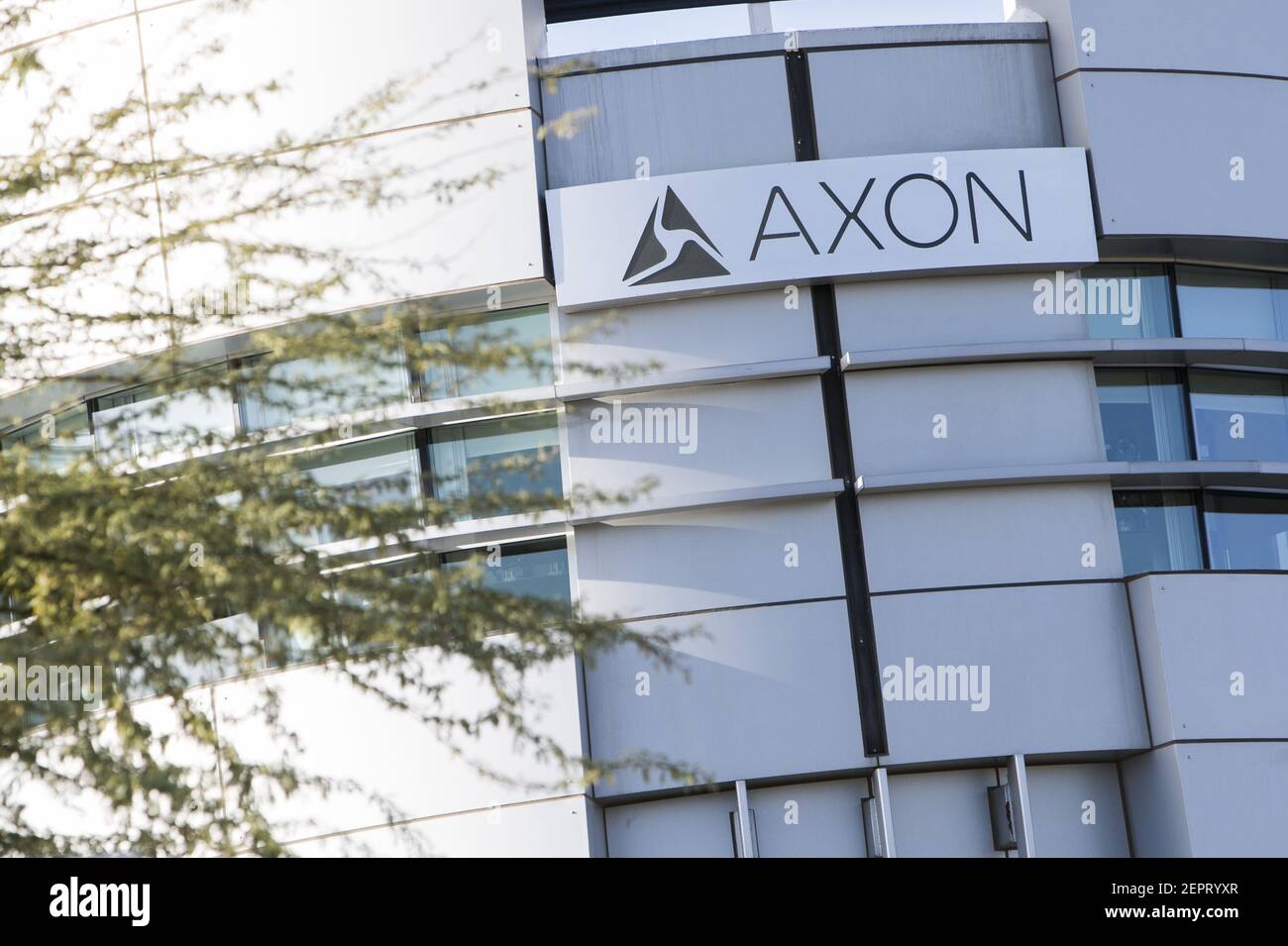 A logo sign outside of the headquarters of Axon in Scottsdale, Arizona ...