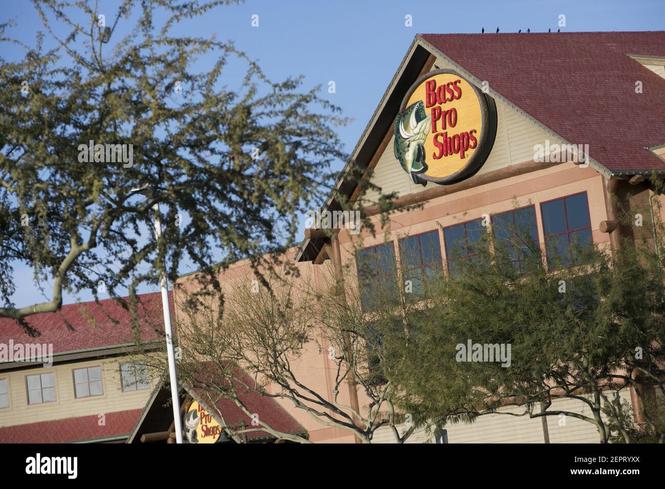 A logo sign outside of a Bass Pro Shops retail store in Mesa, Arizona ...