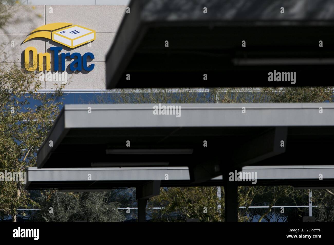 A logo sign outside of the headquarters of OnTrac in Chandler, Arizona ...