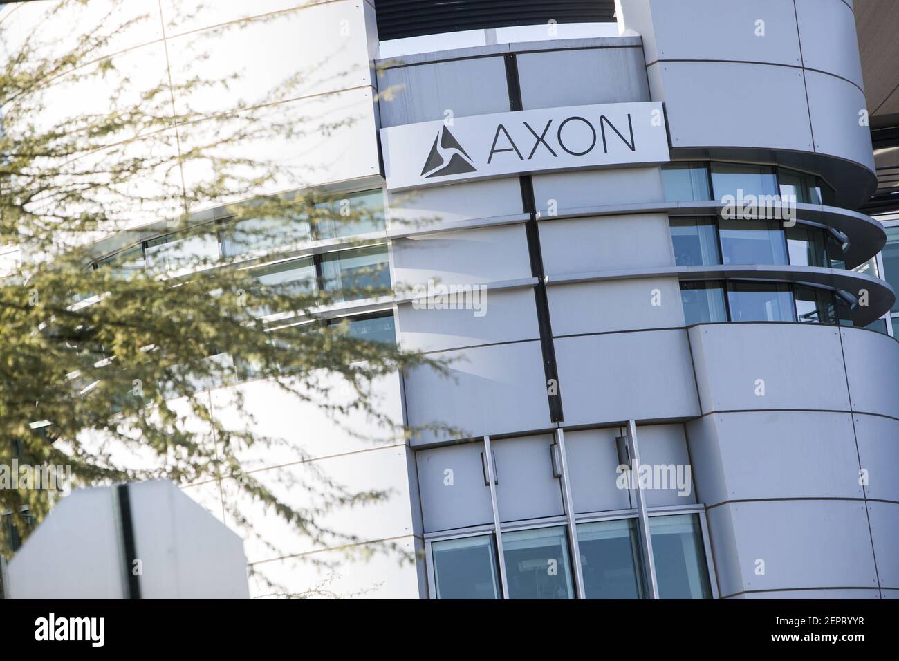 A logo sign outside of the headquarters of Axon in Scottsdale, Arizona ...