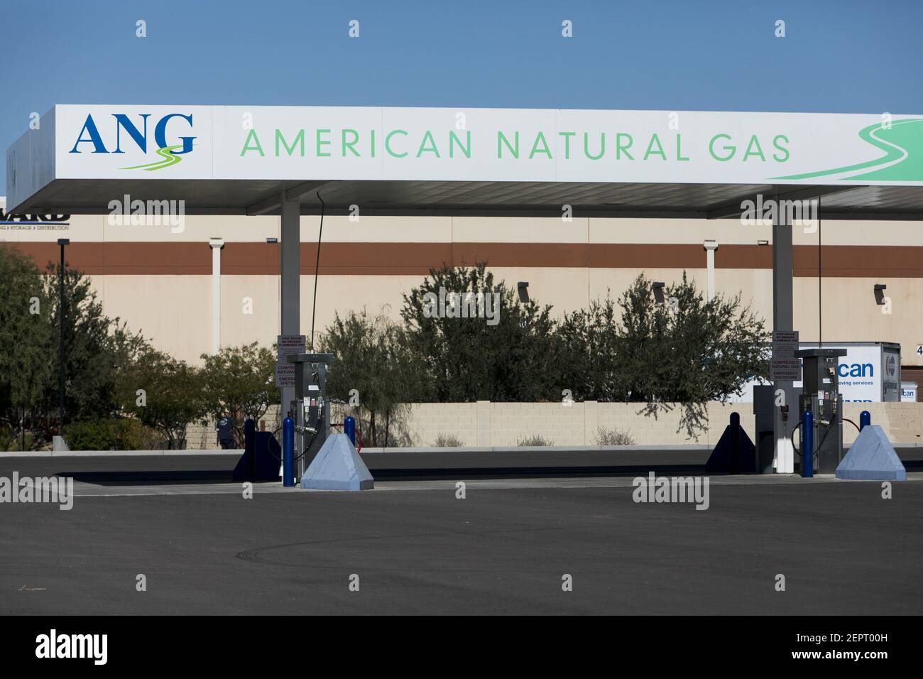 A logo sign outside of a American Natural Gas filling station in ...