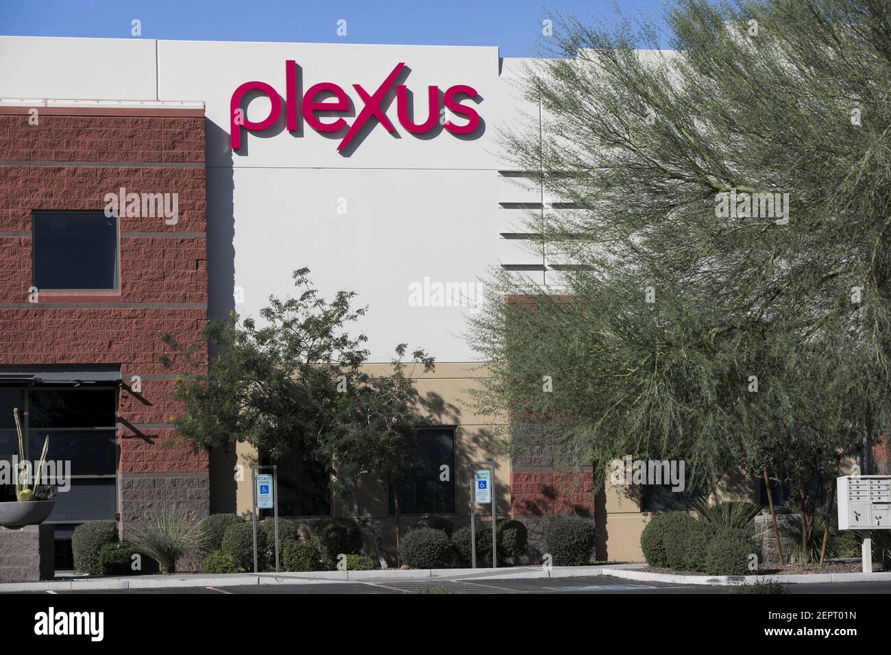 A logo sign outside of the headquarters of Plexus Worldwide in ...
