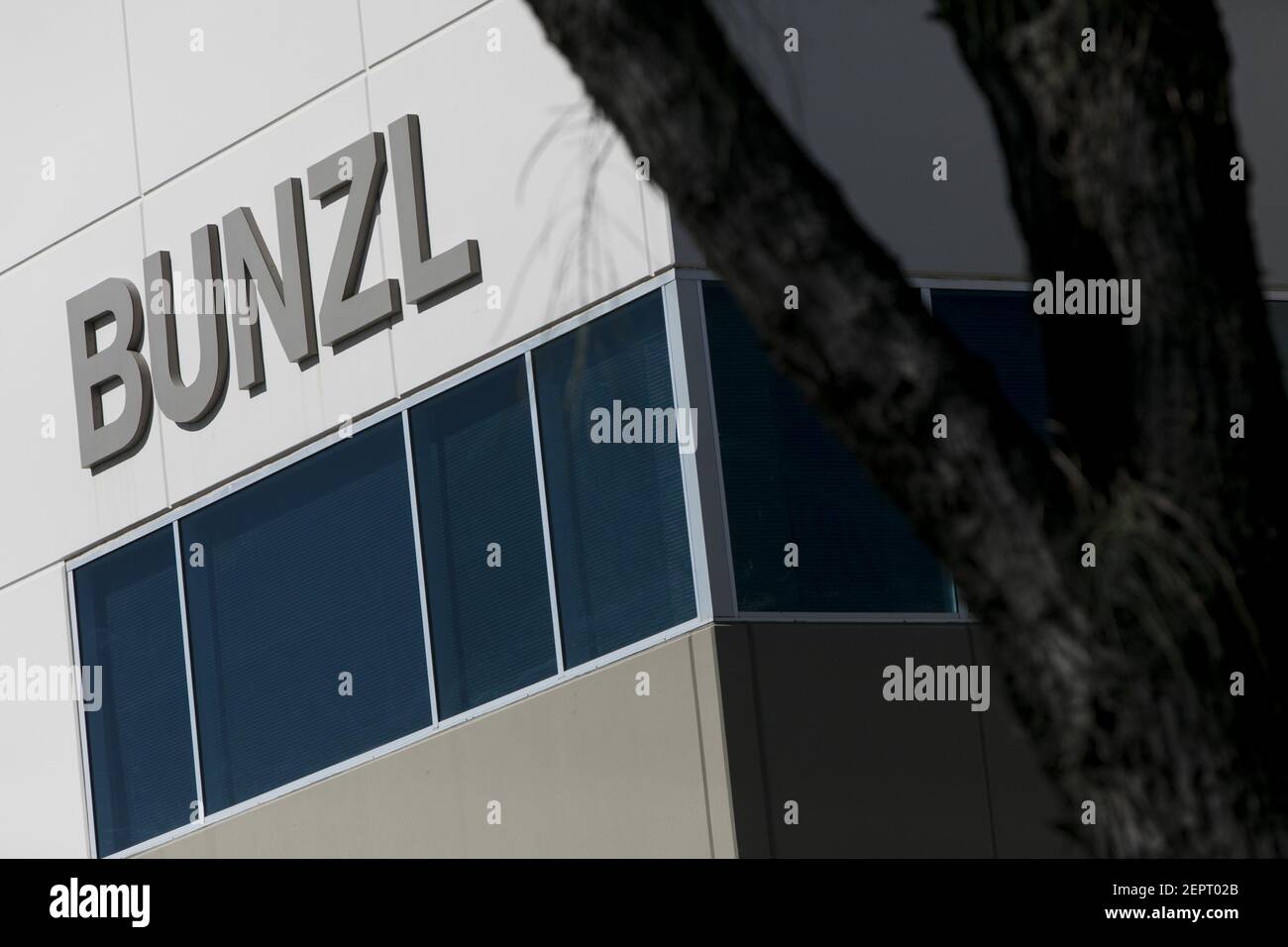 A logo sign outside of a facility occupied by Bunzl in Tempe, Arizona ...