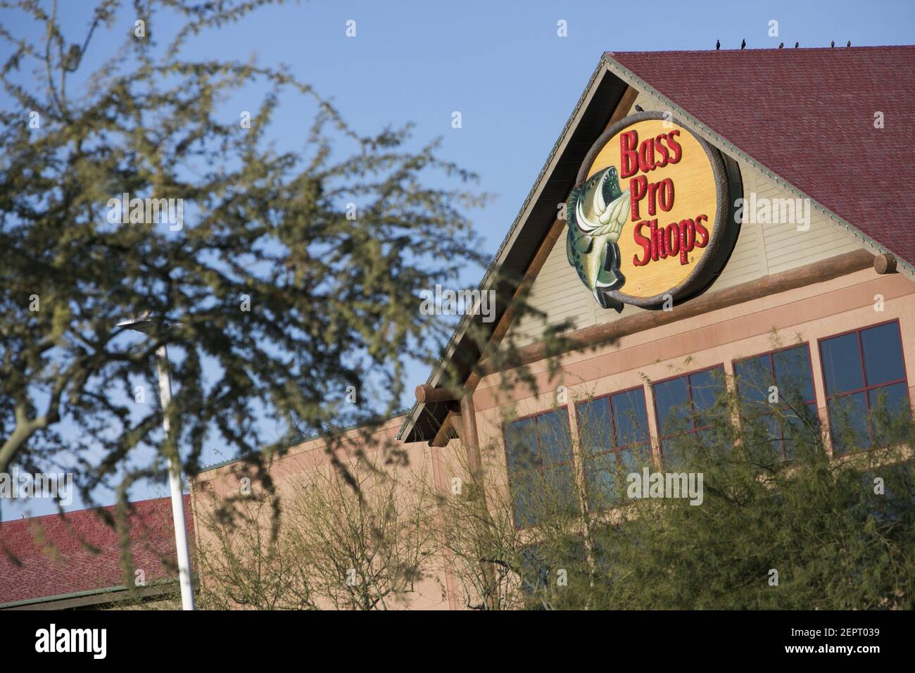 A logo sign outside of a Bass Pro Shops retail store in Mesa, Arizona ...