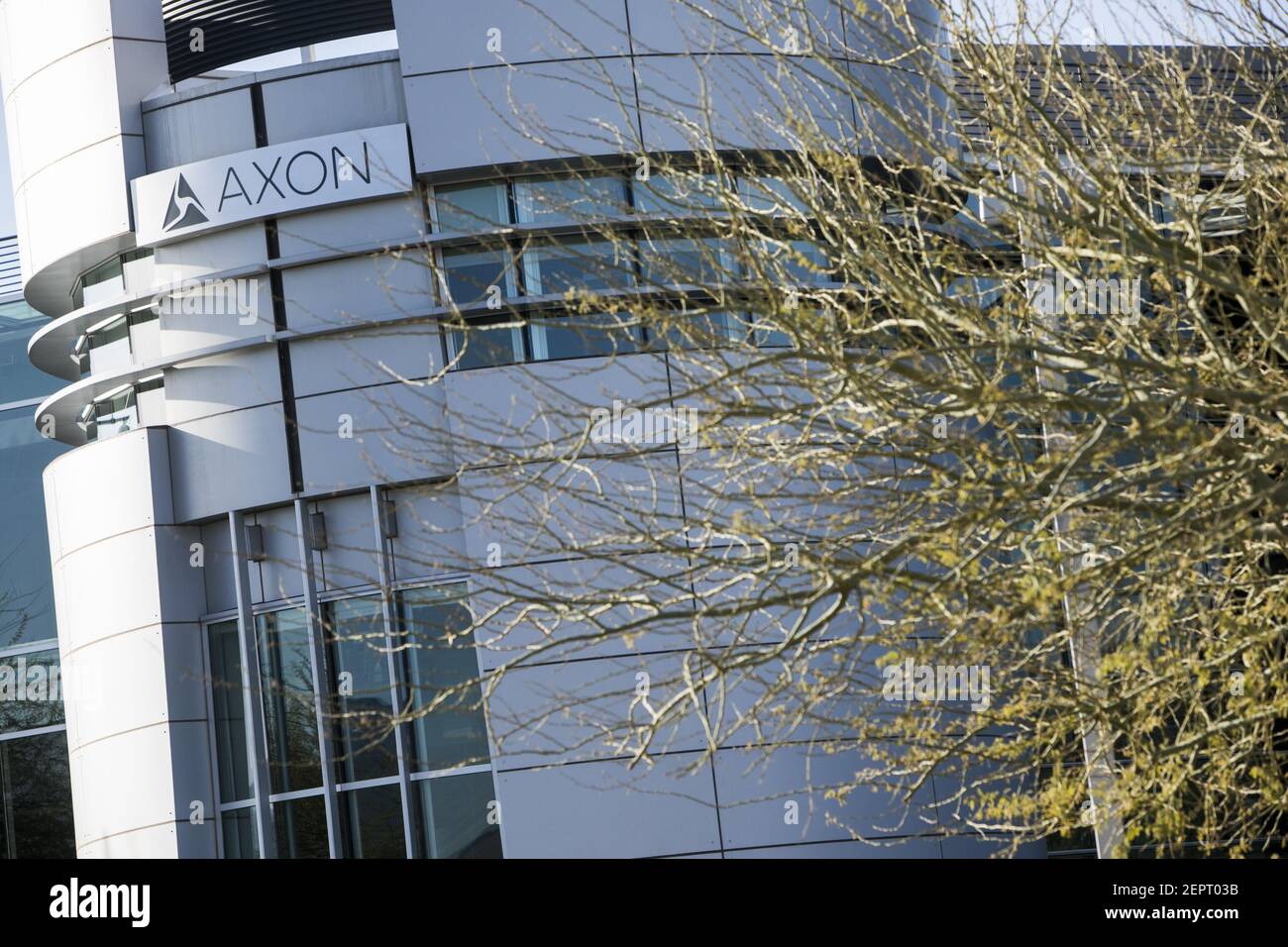 A logo sign outside of the headquarters of Axon in Scottsdale, Arizona ...