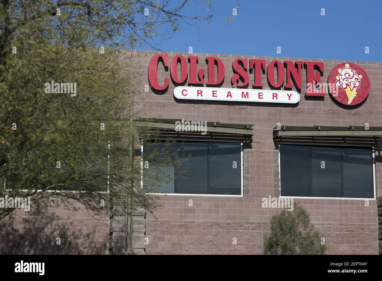 A logo sign outside of the headquarters of Cold Stone Creamery in ...