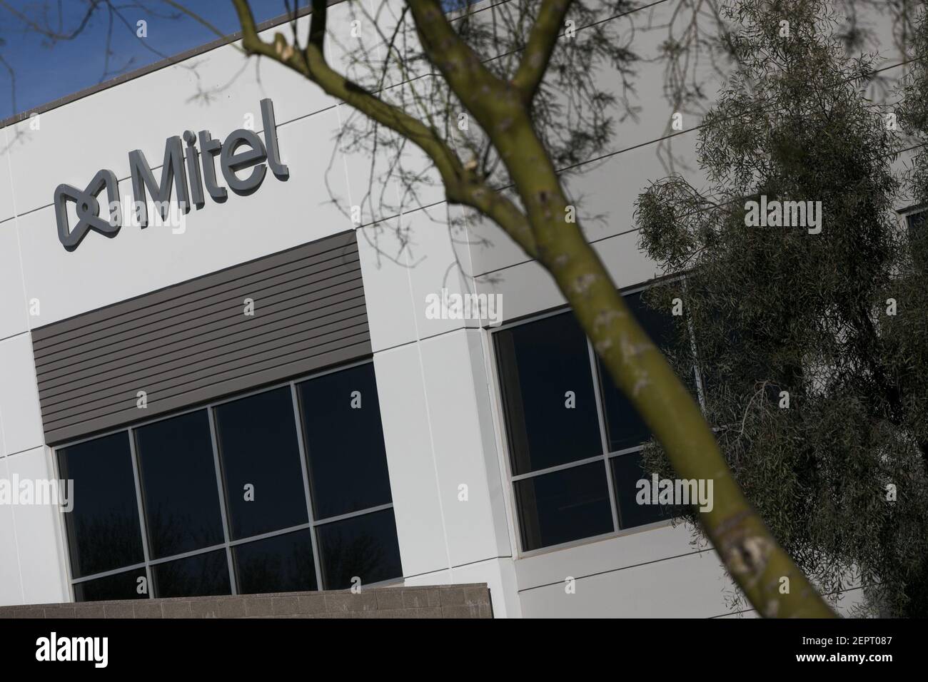 A logo sign outside of a facility occupied by Mitel Networks in Mesa ...
