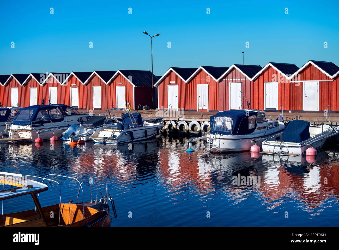 Red-painted boathouses on the west coast in Sweden Stock Photo - Alamy