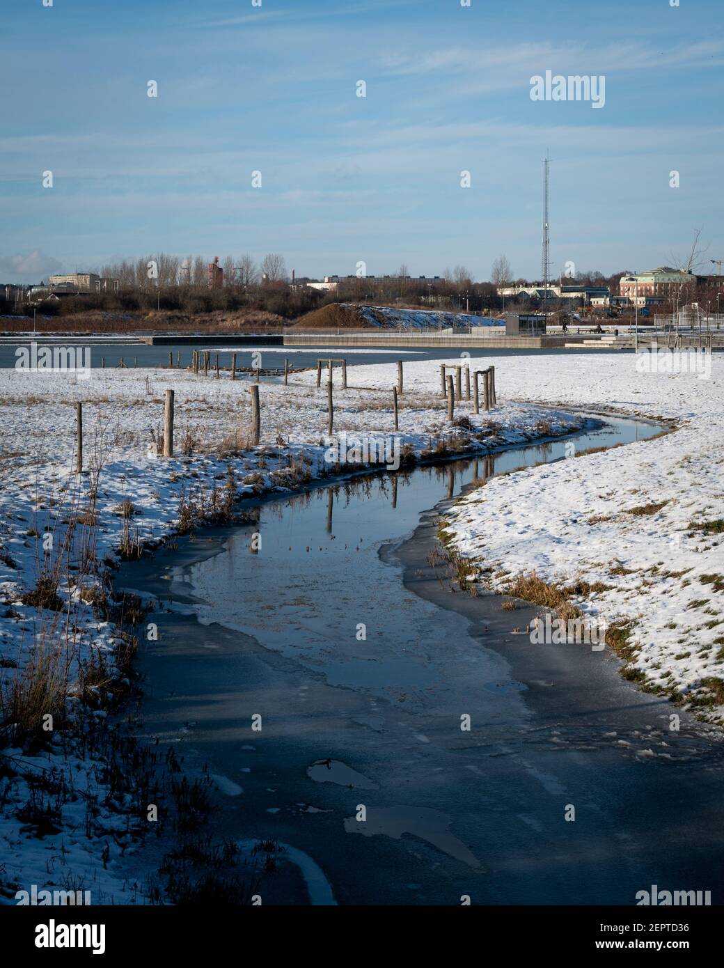 Ice cold stream of water in rural setting during winter in the outer ...