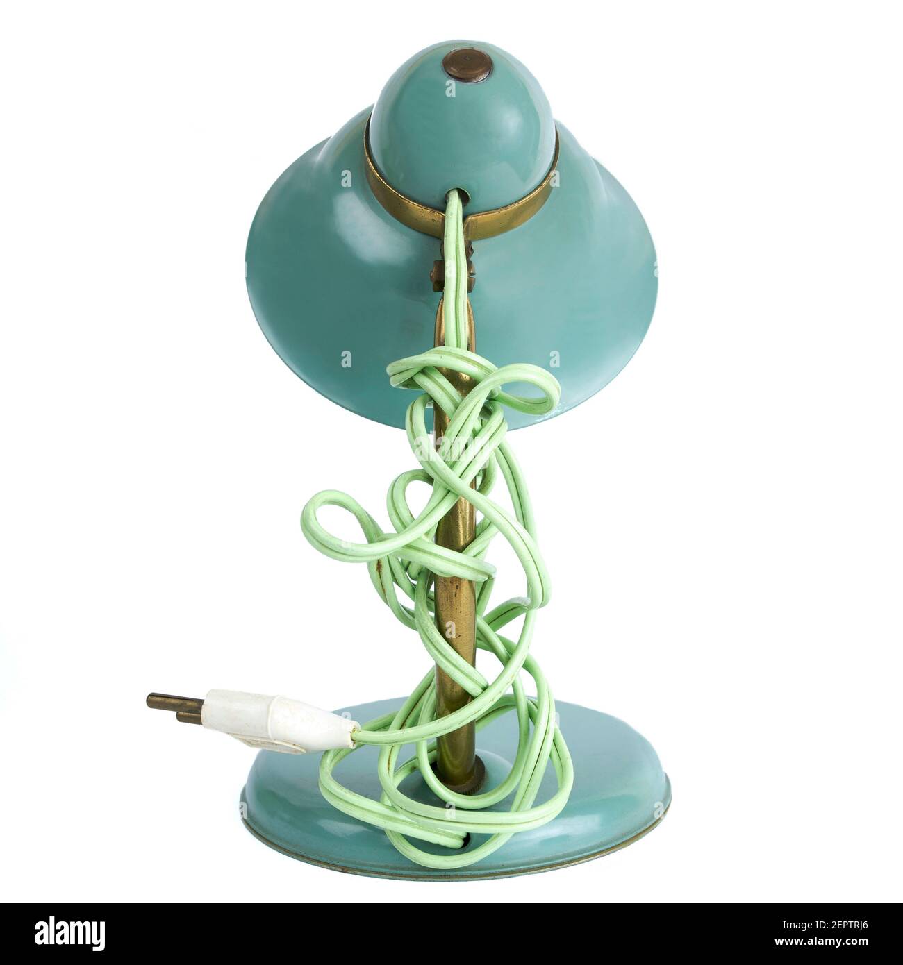 Vintage teal desk lamp with a twisted green cord captured in a ...