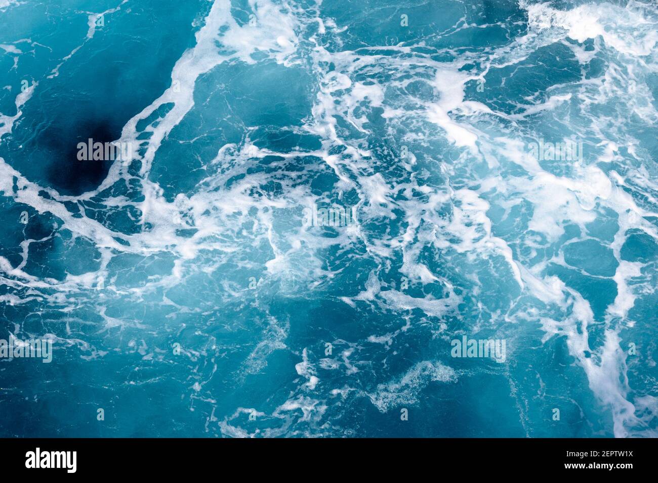 Natural background of blue foaming sea water Stock Photo - Alamy