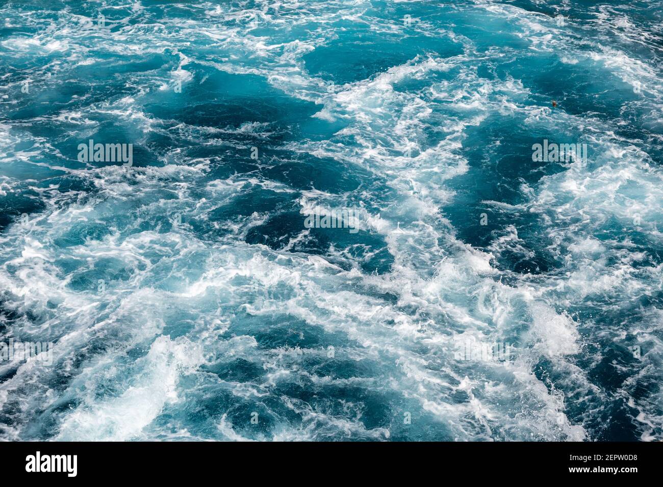 Natural background of blue foaming sea water Stock Photo - Alamy