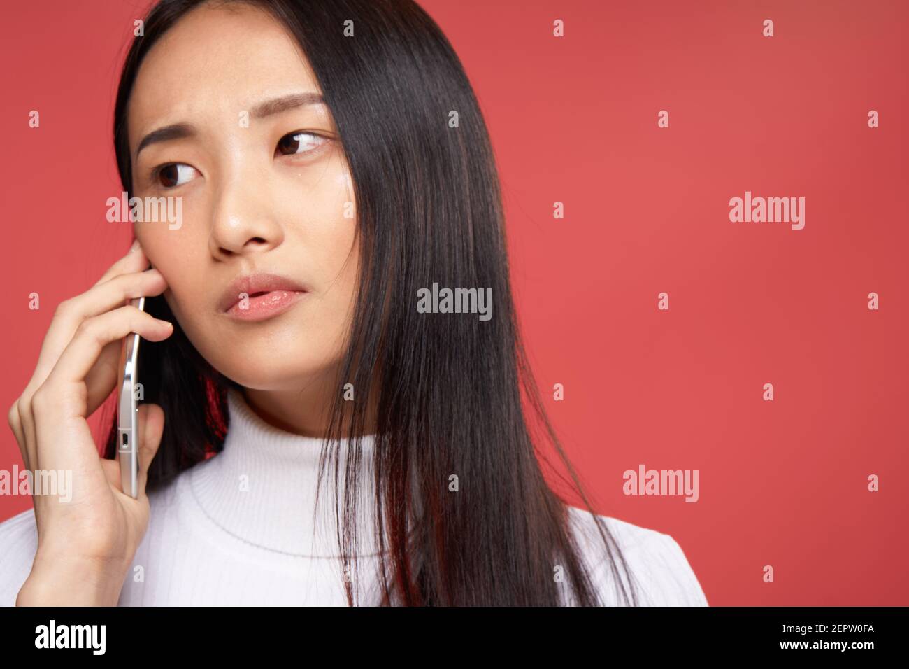 woman asian appearance studio cropped view talking on the phone Stock ...