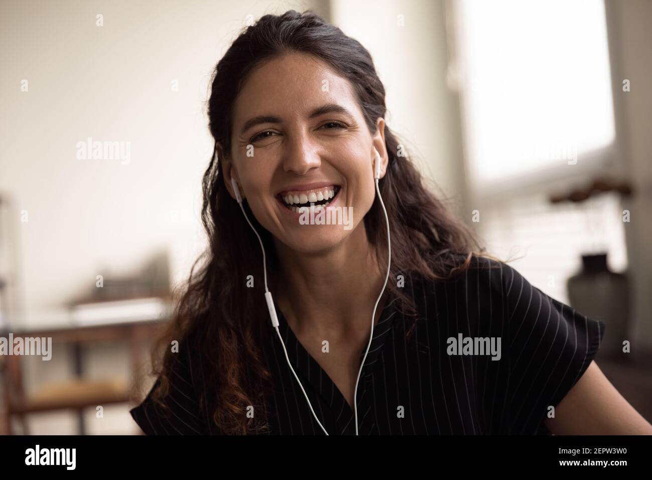 Woman wearing earphones hi-res stock photography and images - Alamy