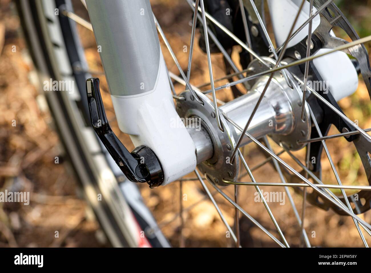 Front bicycle hub with a visible caliper, spokes and a brake disc Stock ...