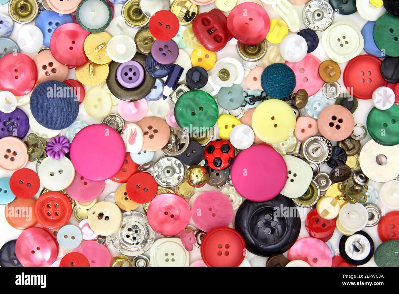 Set of buttons and sewing accessories in very different colors, sizes ...