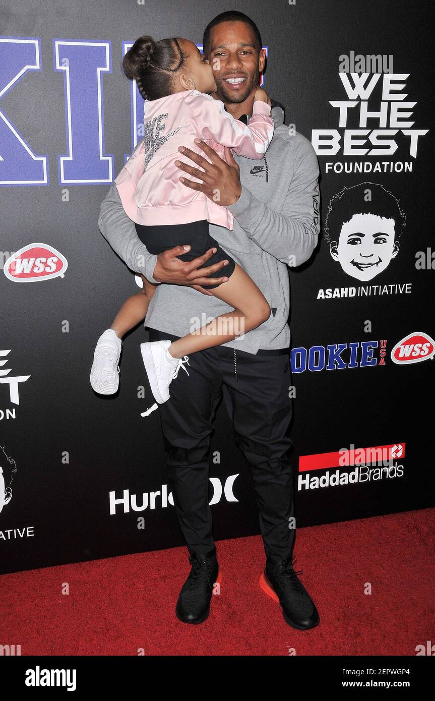 (R-L) Victor Cruz and daughter Kennedy Cruz arrives at the 2018 Rookie ...