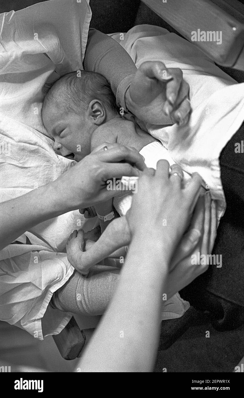 Childrens Ward Cardiff Hospital. Woman with new baby nurse chasing ...
