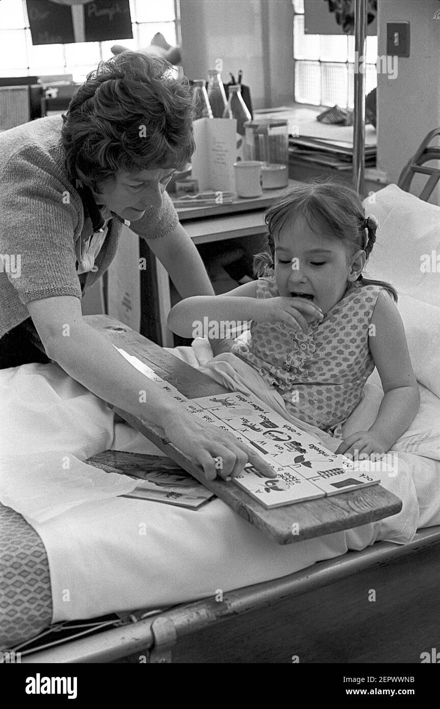 Childrens Ward Cardiff Hospital hospital. Visitor teaching child Stock ...