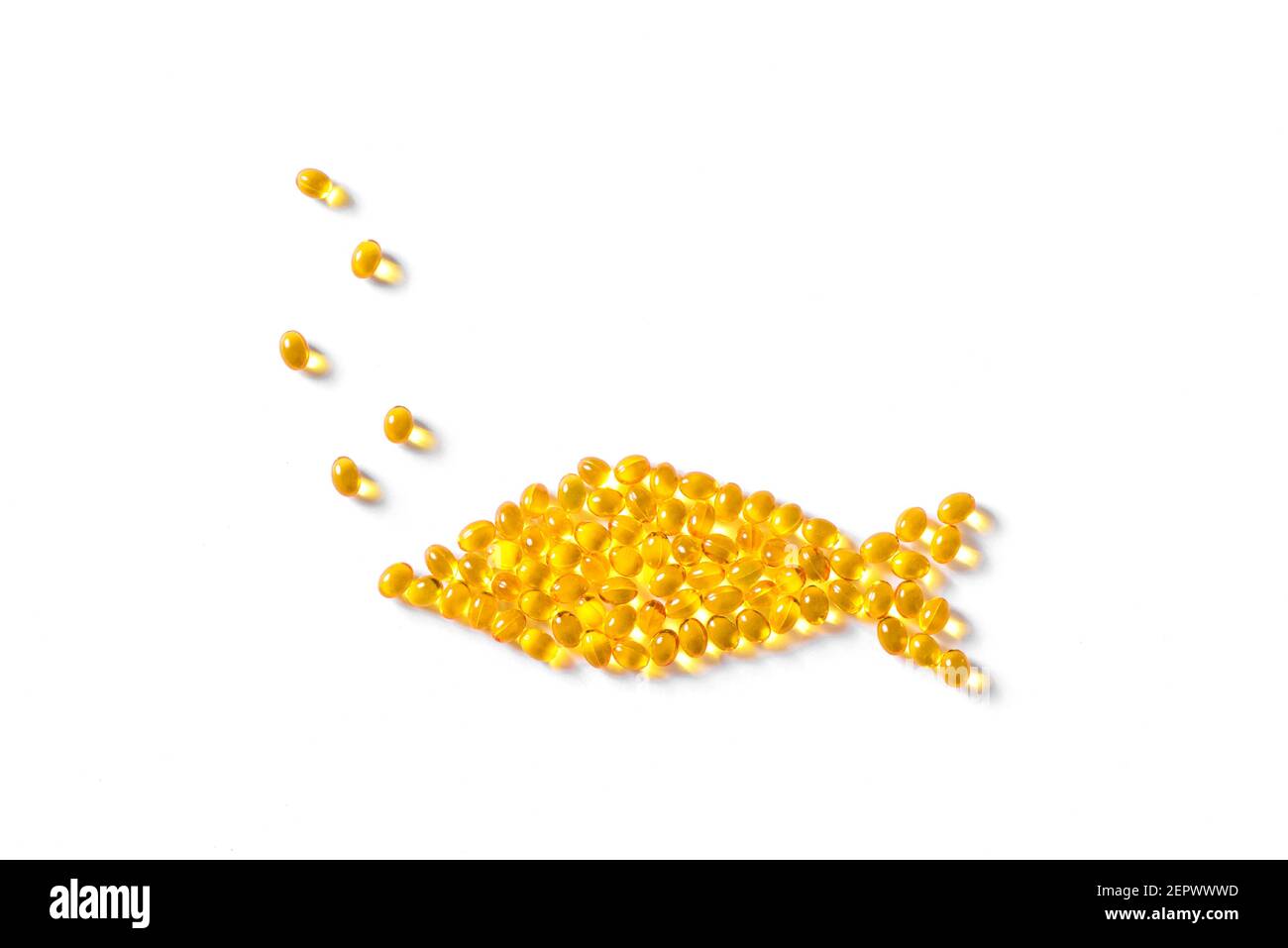 Omega 3 fish oil capsules (softgels) in shape of fish. Yellow softgels ...