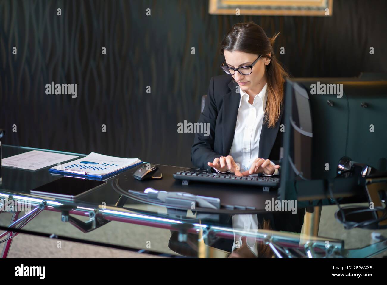 Woman using her personal computer at work Stock Photo - Alamy