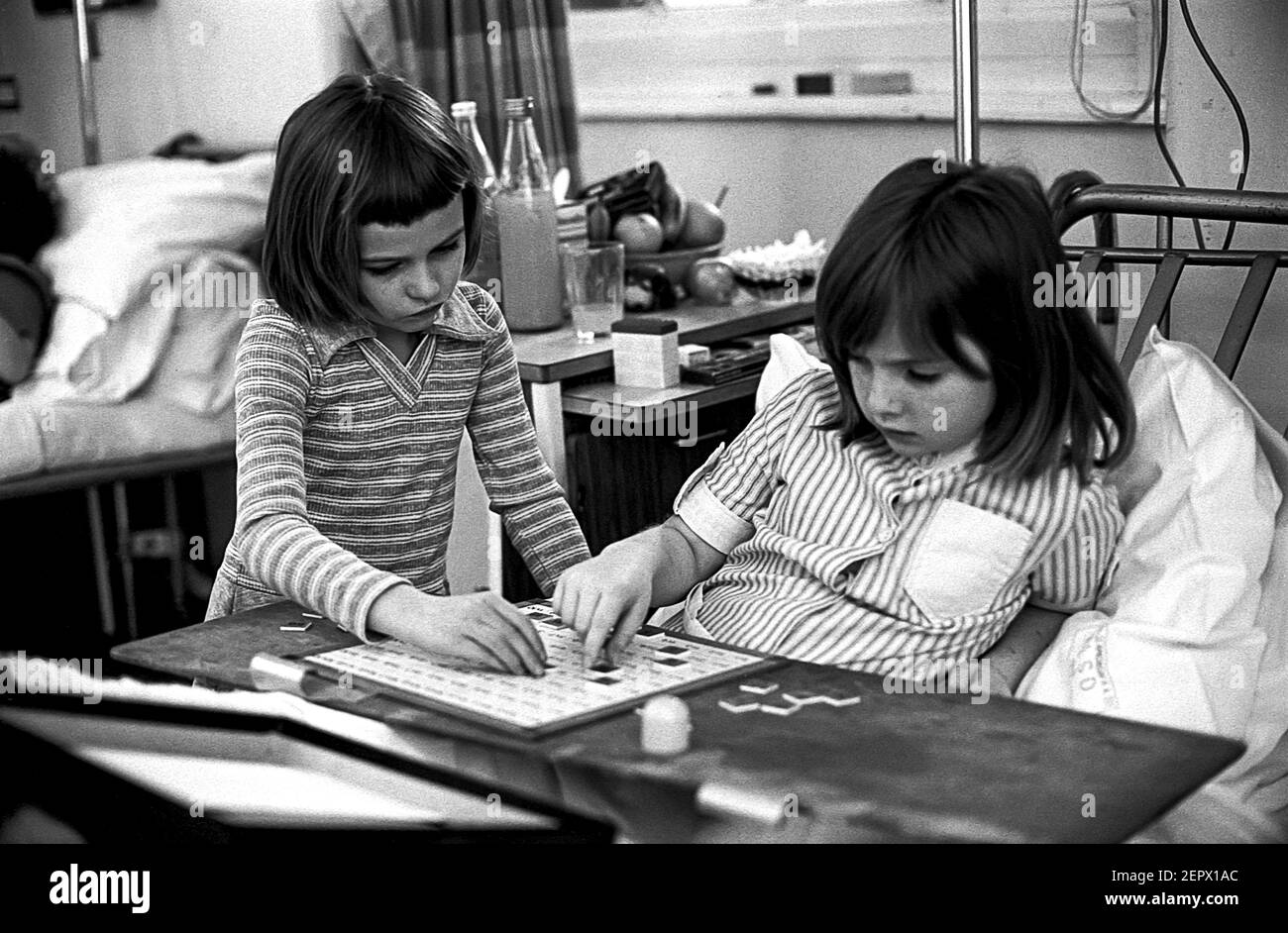 Childrens Ward Cardiff Hospital. Two sick Children playing board game ...