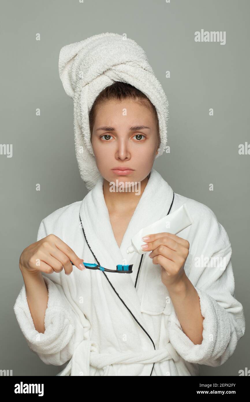 Unhappy sleepy tired woman brushing her teeth, female routine Stock ...