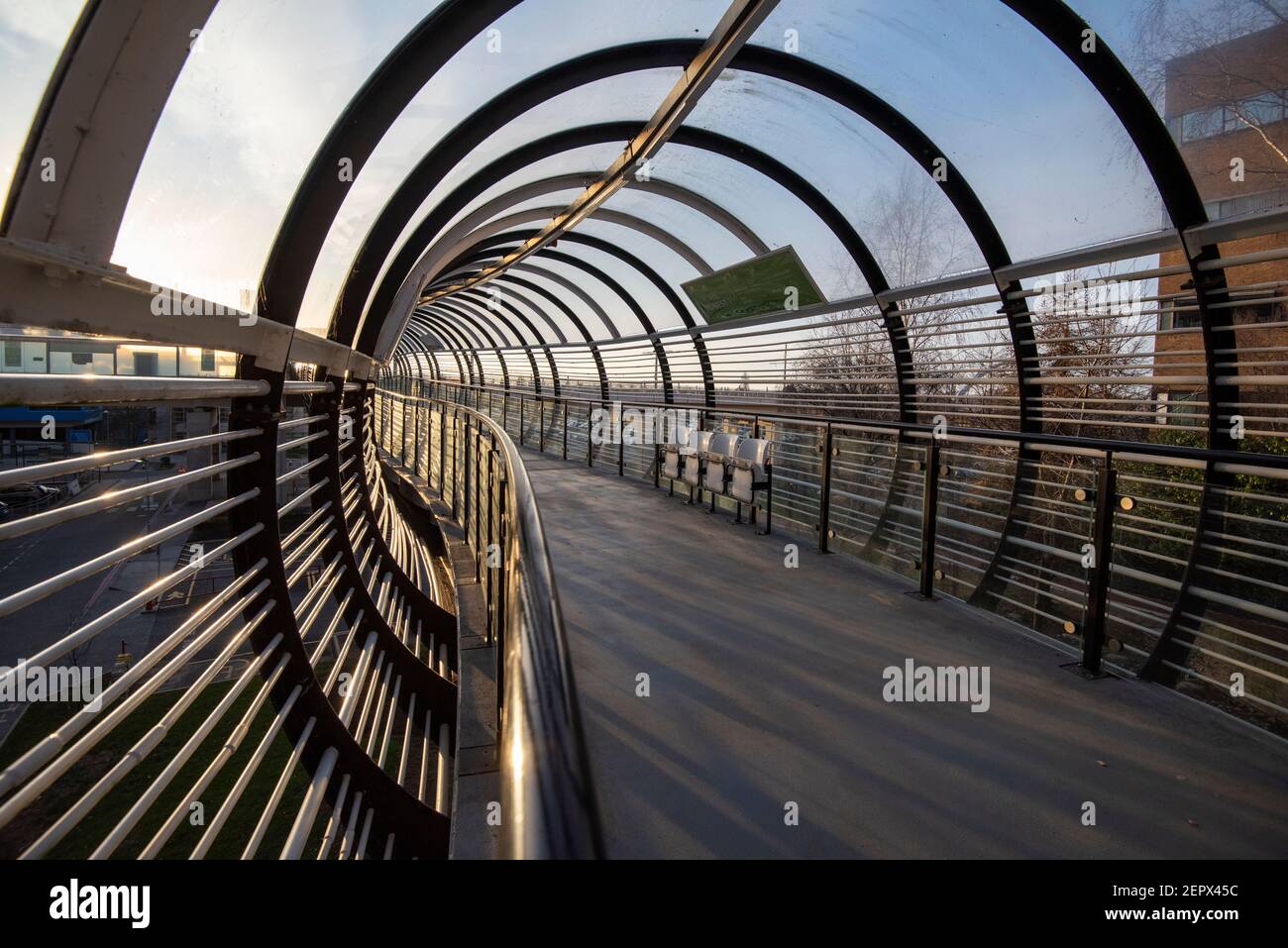 Morning light on the Sir Peter Mansfield tram bridge at the Queens ...