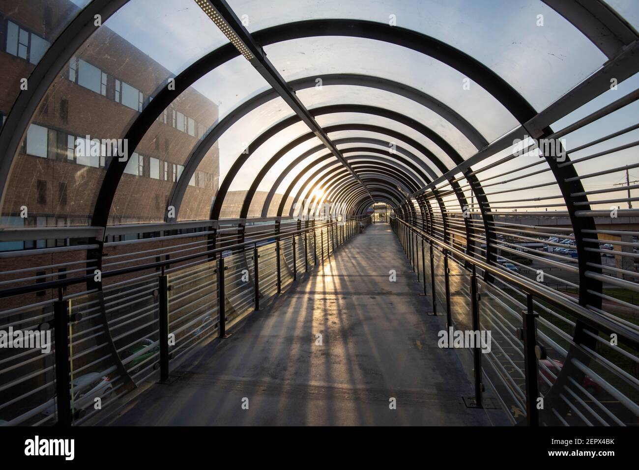 Morning light on the Sir Peter Mansfield tram bridge at the Queens ...