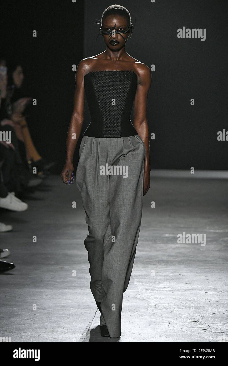 Model Wayne Booth walks on the runway during the Gareth Pugh Fashion ...