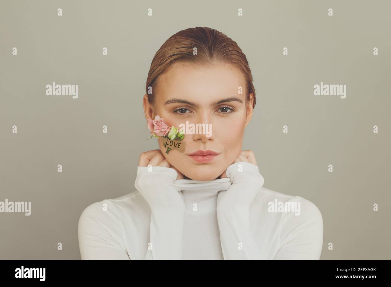 Beautiful woman with rose flowers and Love inscription on adhesive ...
