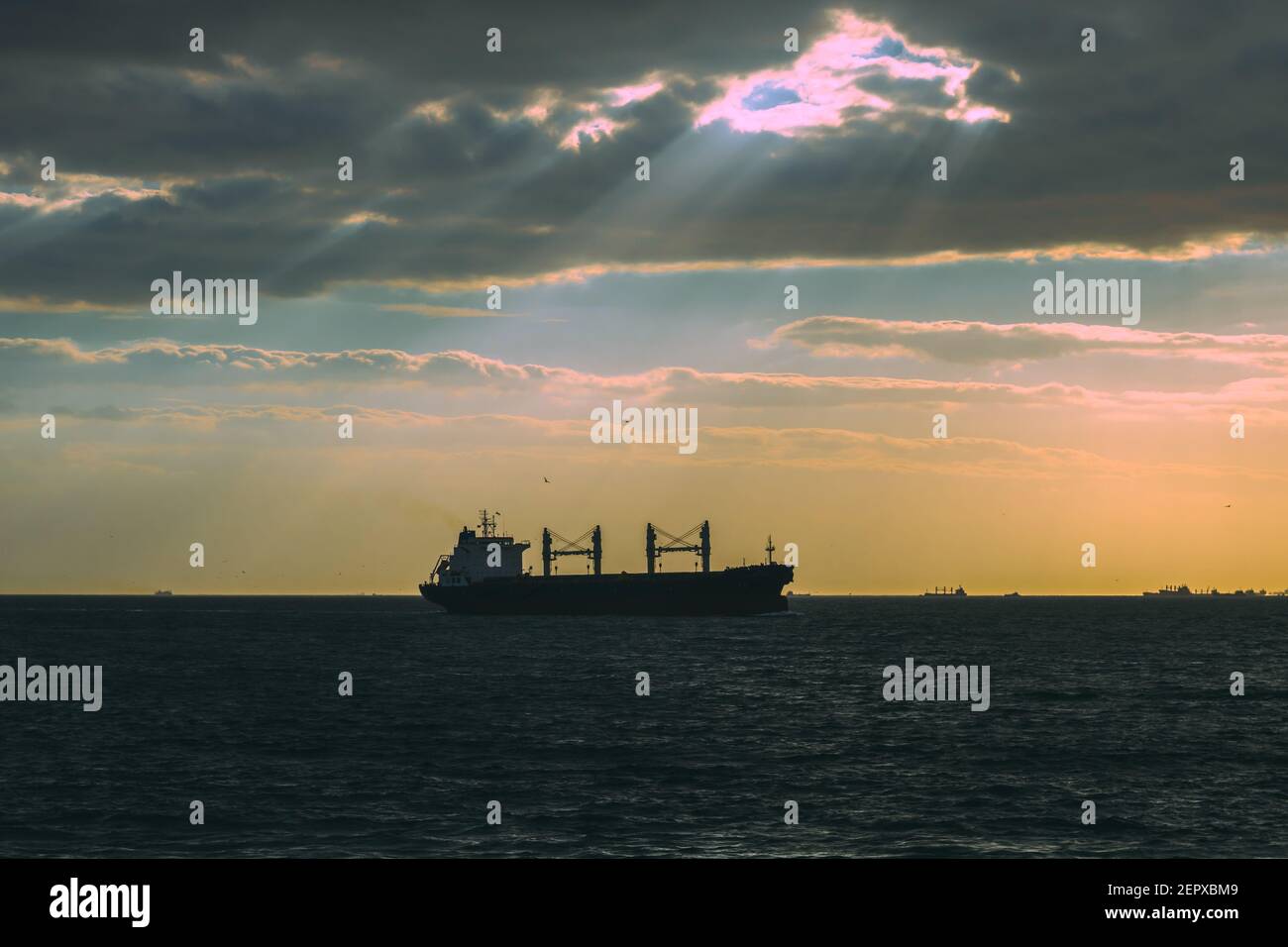 Bulk Carrier ship and sunlight beams Stock Photo - Alamy