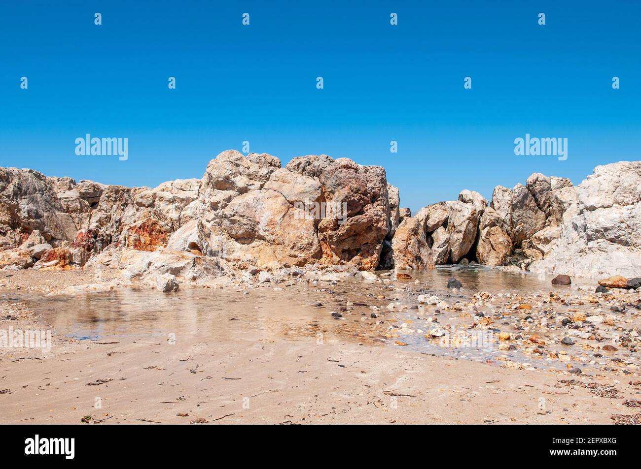 Rocky grottoes on a picturesque beach on the Kos island, Greece Stock ...