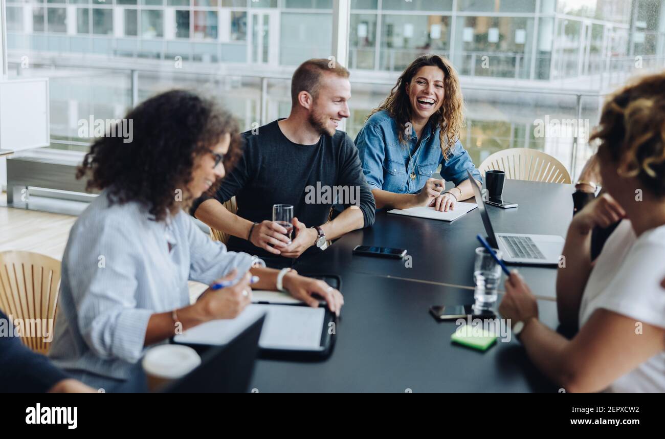 businesspeople smiling during a meeting. business people smiling after ...