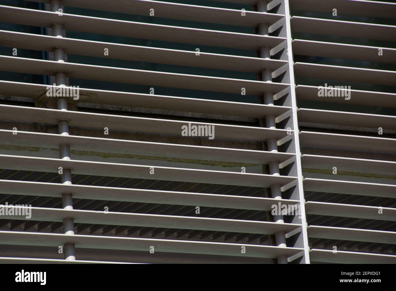 Front view of the horizontal sun blind shading in front of a window ...