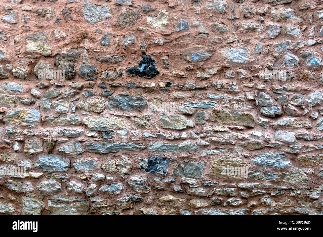 Irregular stone wall texture background photo Stock Photo - Alamy