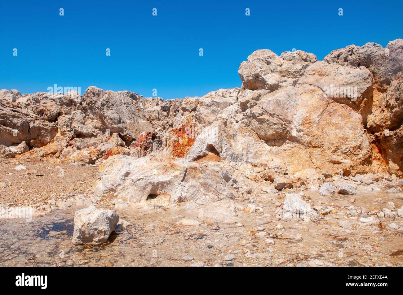 Rocky grottoes on a picturesque beach on the Kos island, Greece Stock ...