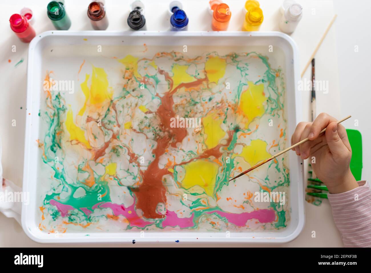 Children's hands drawing picture hi-res stock photography and images ...