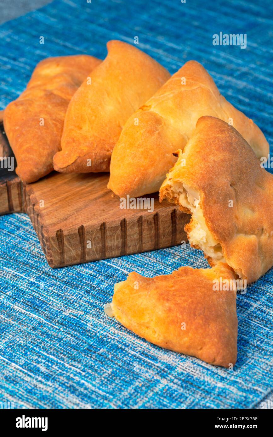 Tatar national pie echpochmak on wood plate Stock Photo - Alamy