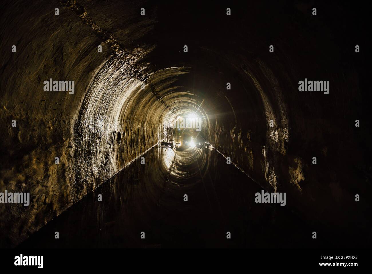 Flooded vaulted sewer tunnel with water reflection Stock Photo - Alamy