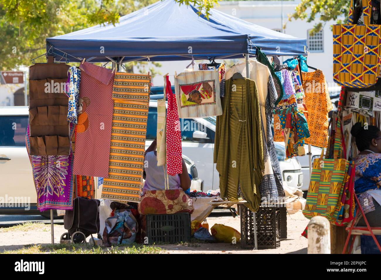 street market stall displaying African arts and crafts and handiwork ...
