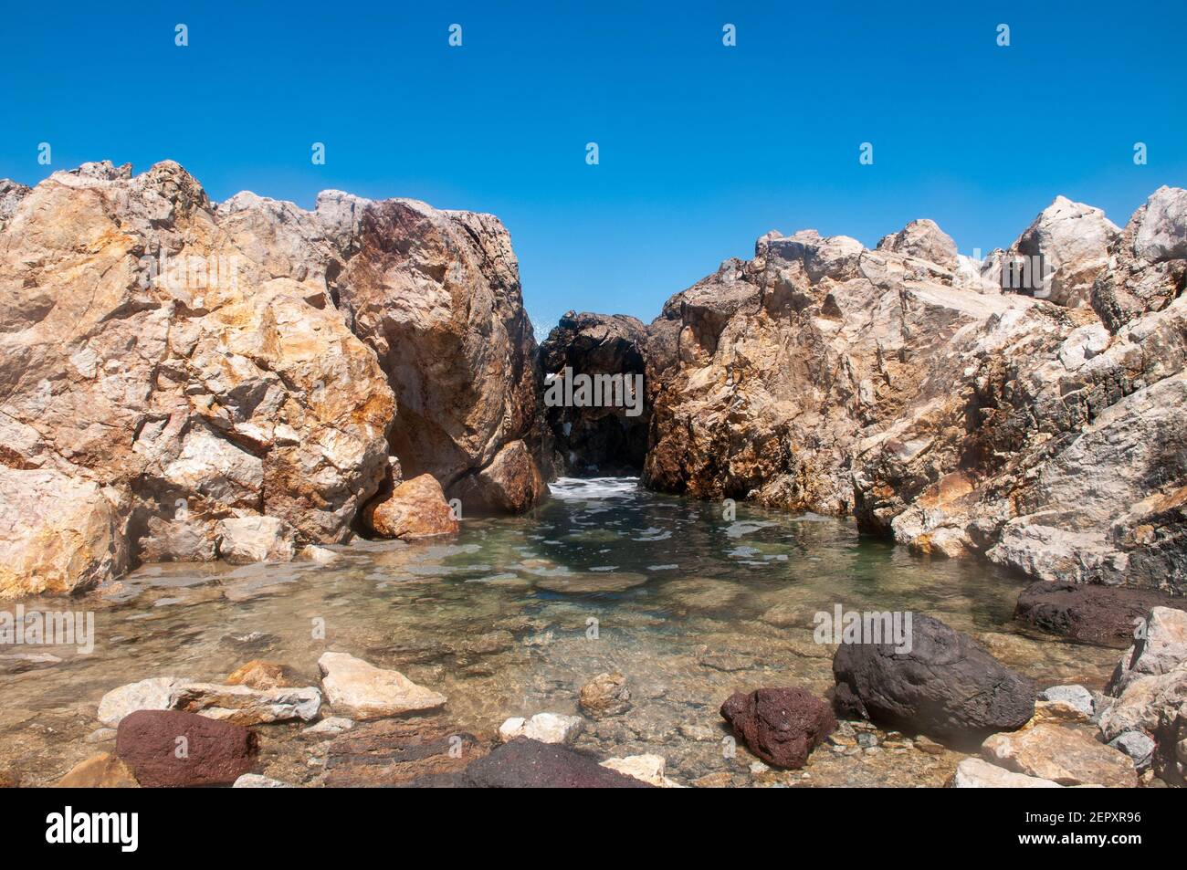 Rocky grottoes on a picturesque beach on the Kos island, Greece Stock ...